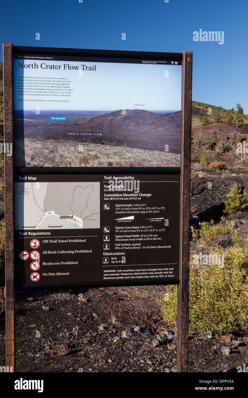 Sign with maps of trails in the rugged terrain of Craters of the Moon ...