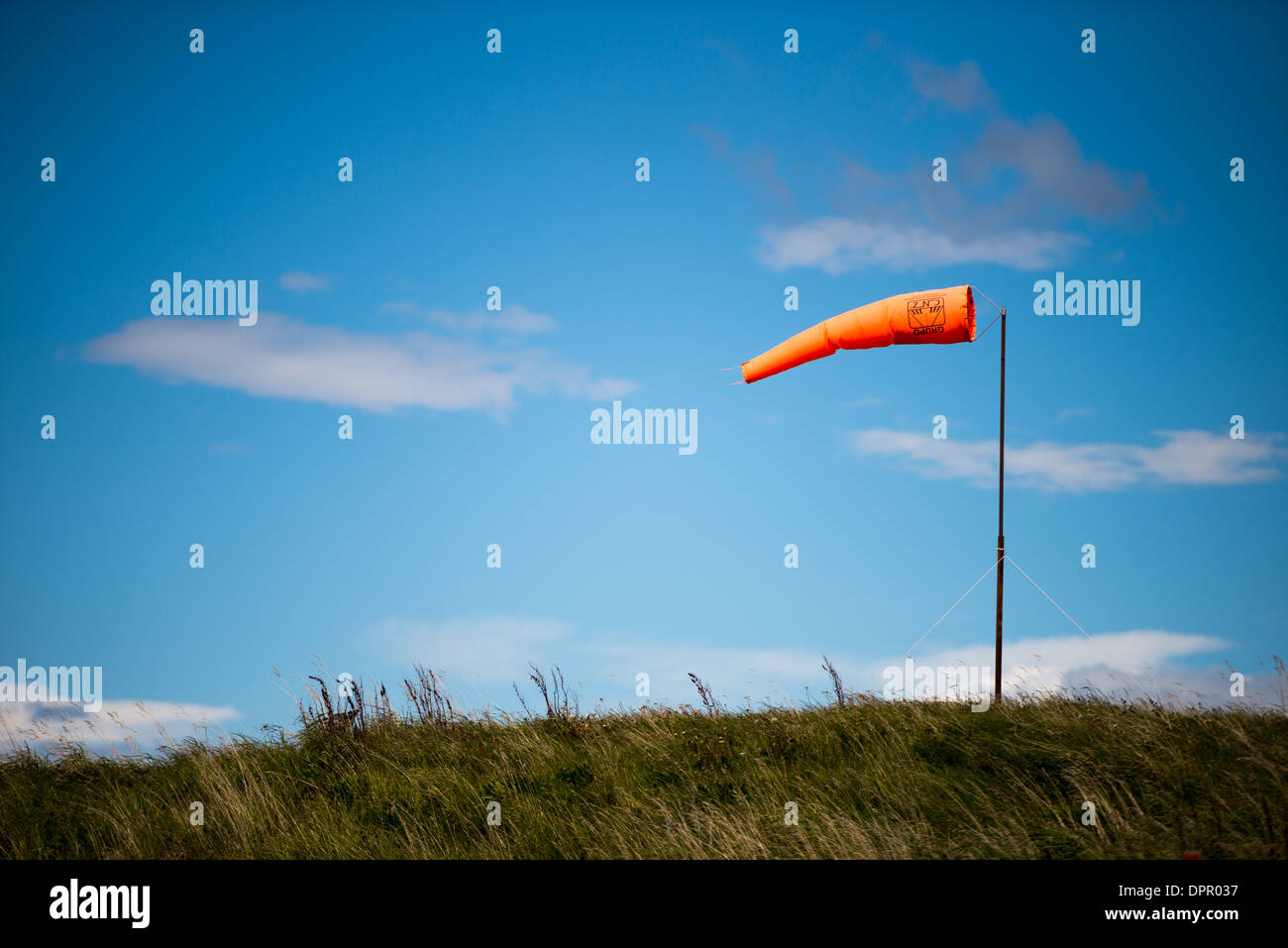 A windsock blows in strong wind at Ushuaia Airport, Argentina Stock ...