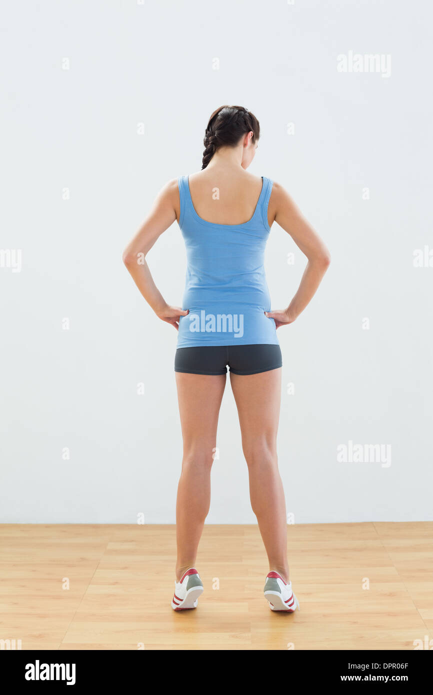 Rear view of a slim woman tip toeing Stock Photo - Alamy