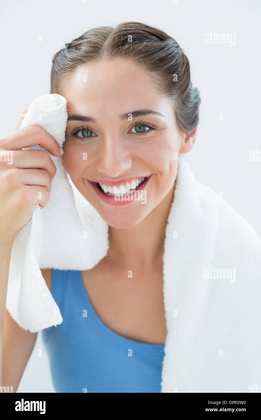 Woman wiping her face with a towel hi-res stock photography and images ...