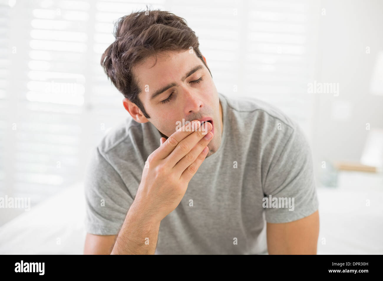 Man sitting up in bed hi-res stock photography and images - Alamy