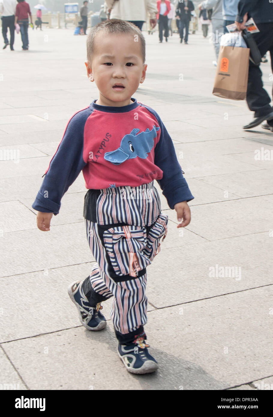 Beijing, China. 16th Oct, 2006. A young Chinese boy walks through ...