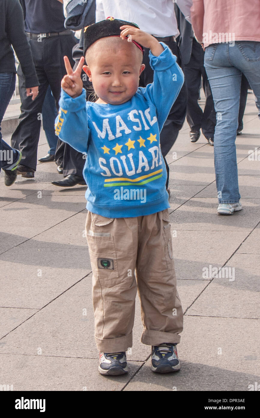 Beijing, China. 16th Oct, 2006. A young Chinese boy makes the V sign ...