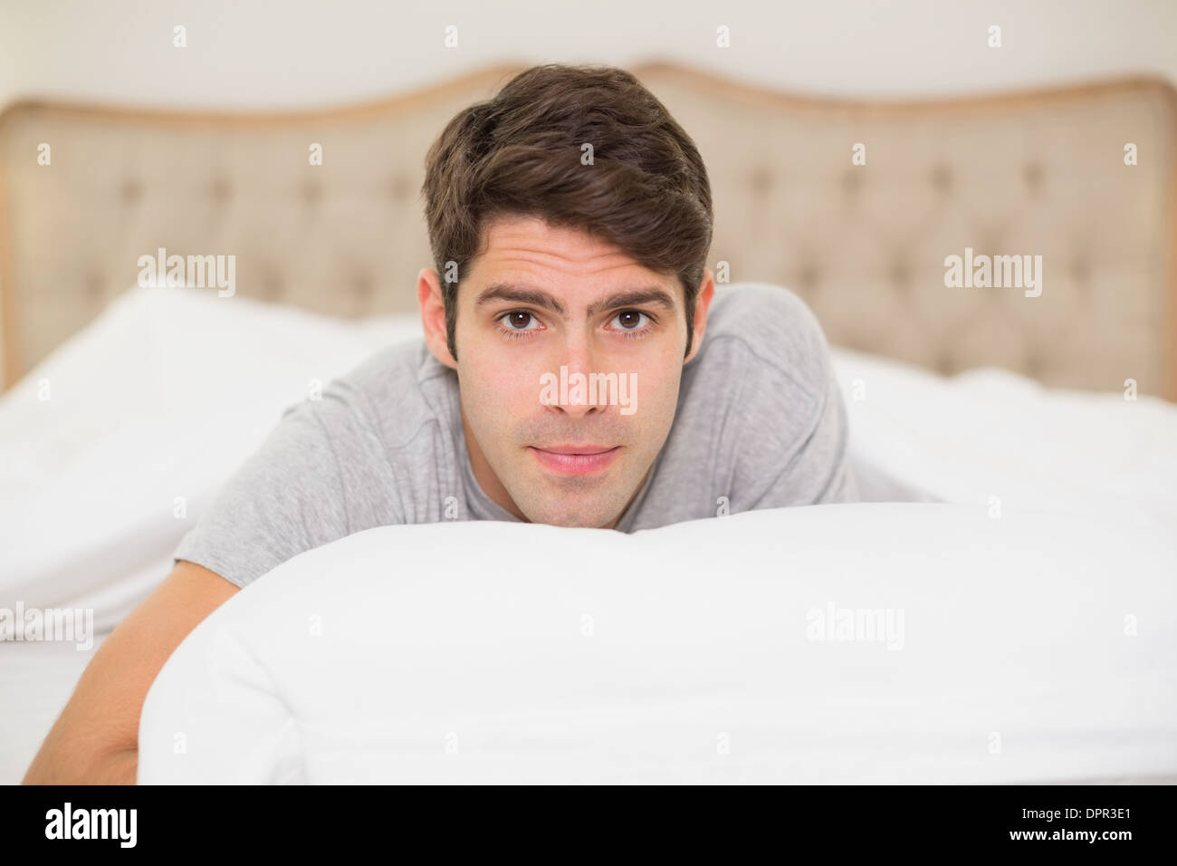 Handsome man portrait bed hi-res stock photography and images - Alamy