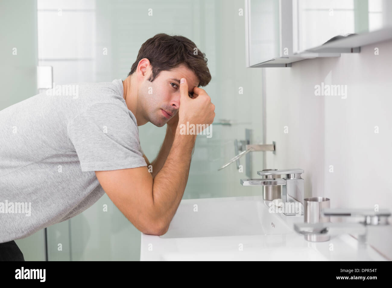 Tensed young man hi-res stock photography and images - Alamy