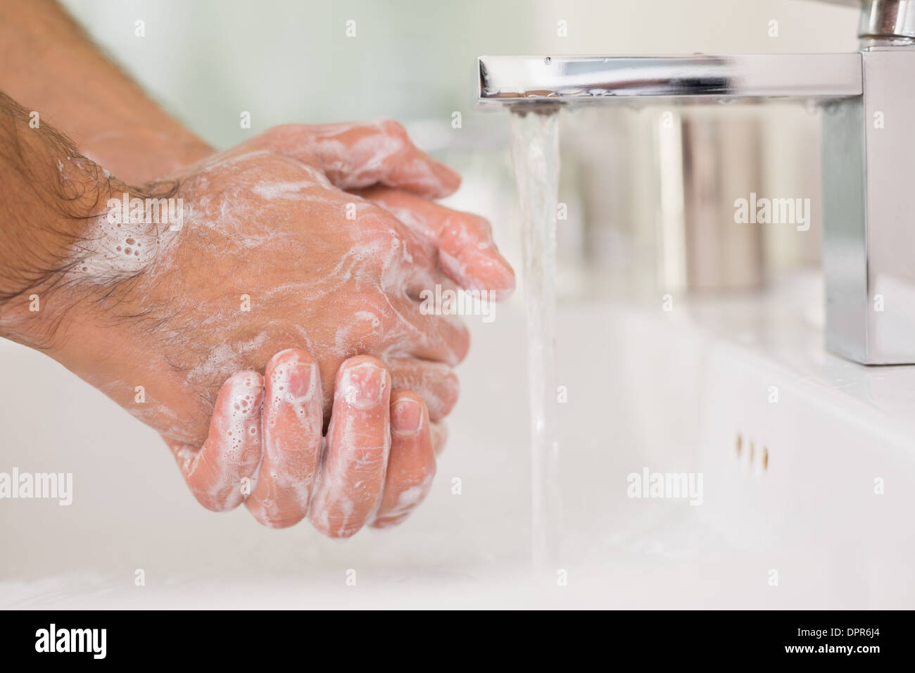 Hands washing under water hi-res stock photography and images - Alamy