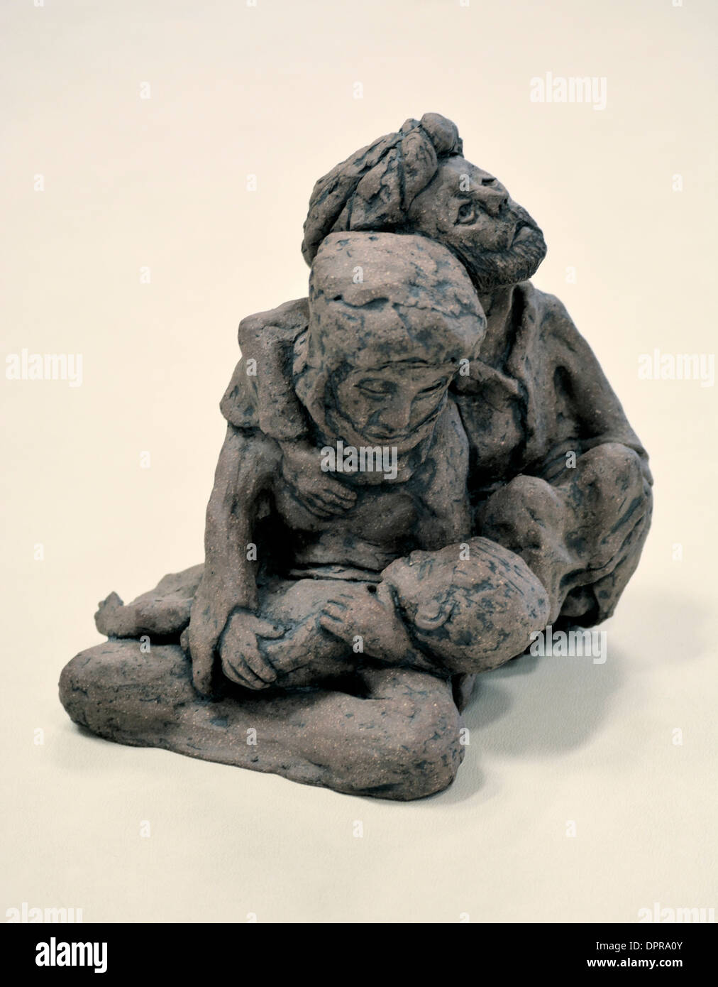 Figurine of two people comforting each other Stock Photo - Alamy