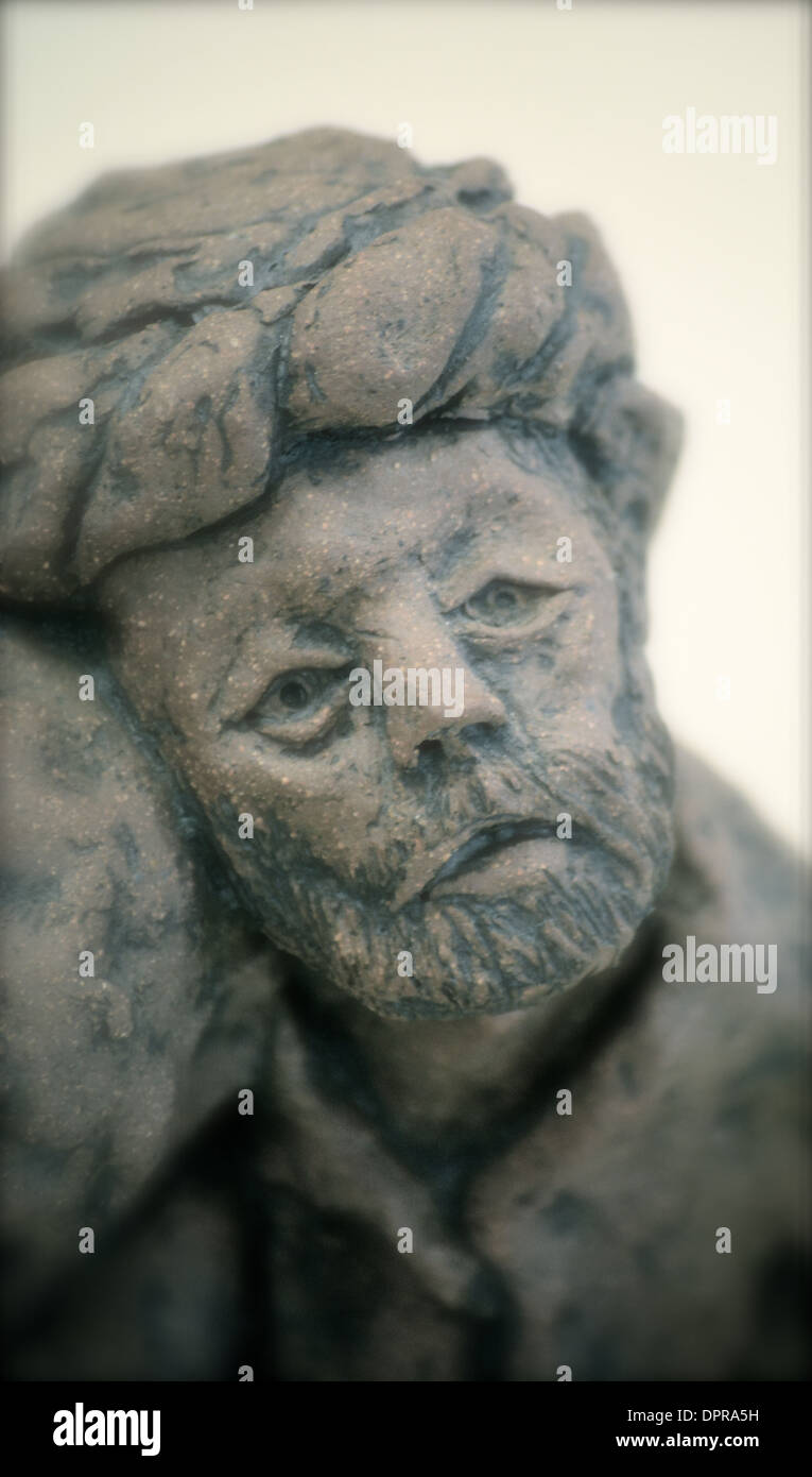 Figurine of two people comforting each other Stock Photo - Alamy