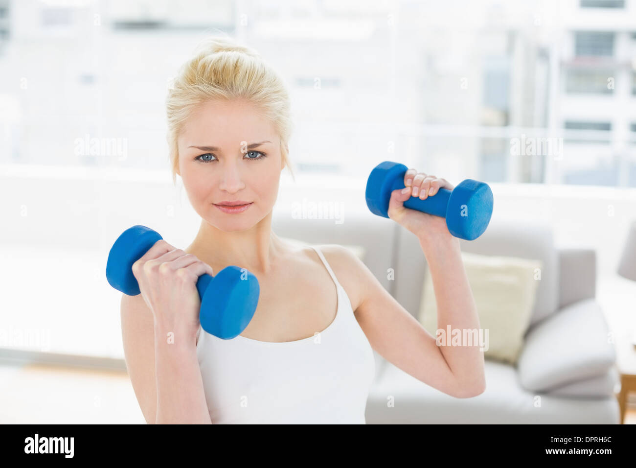 Woman lifting up top hi-res stock photography and images - Alamy