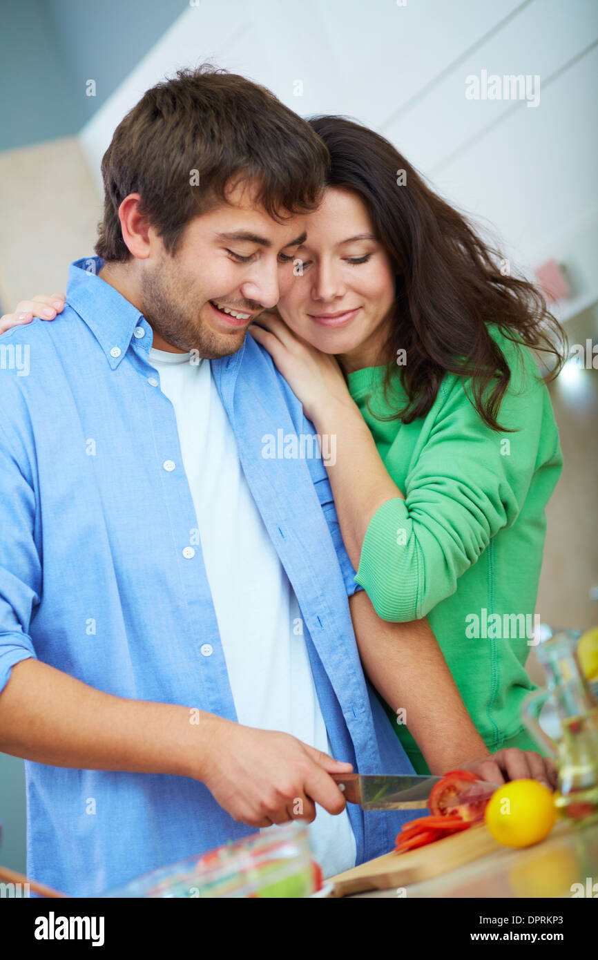 Amorous couple standing in kitchen hi-res stock photography and images ...