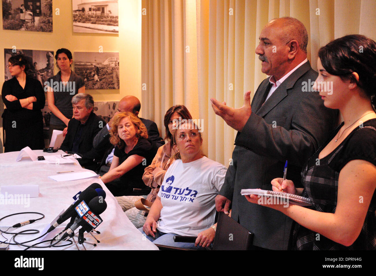 Dec 08, 2008 - Sderot, Israel - Italian Parliament member is handing a ...