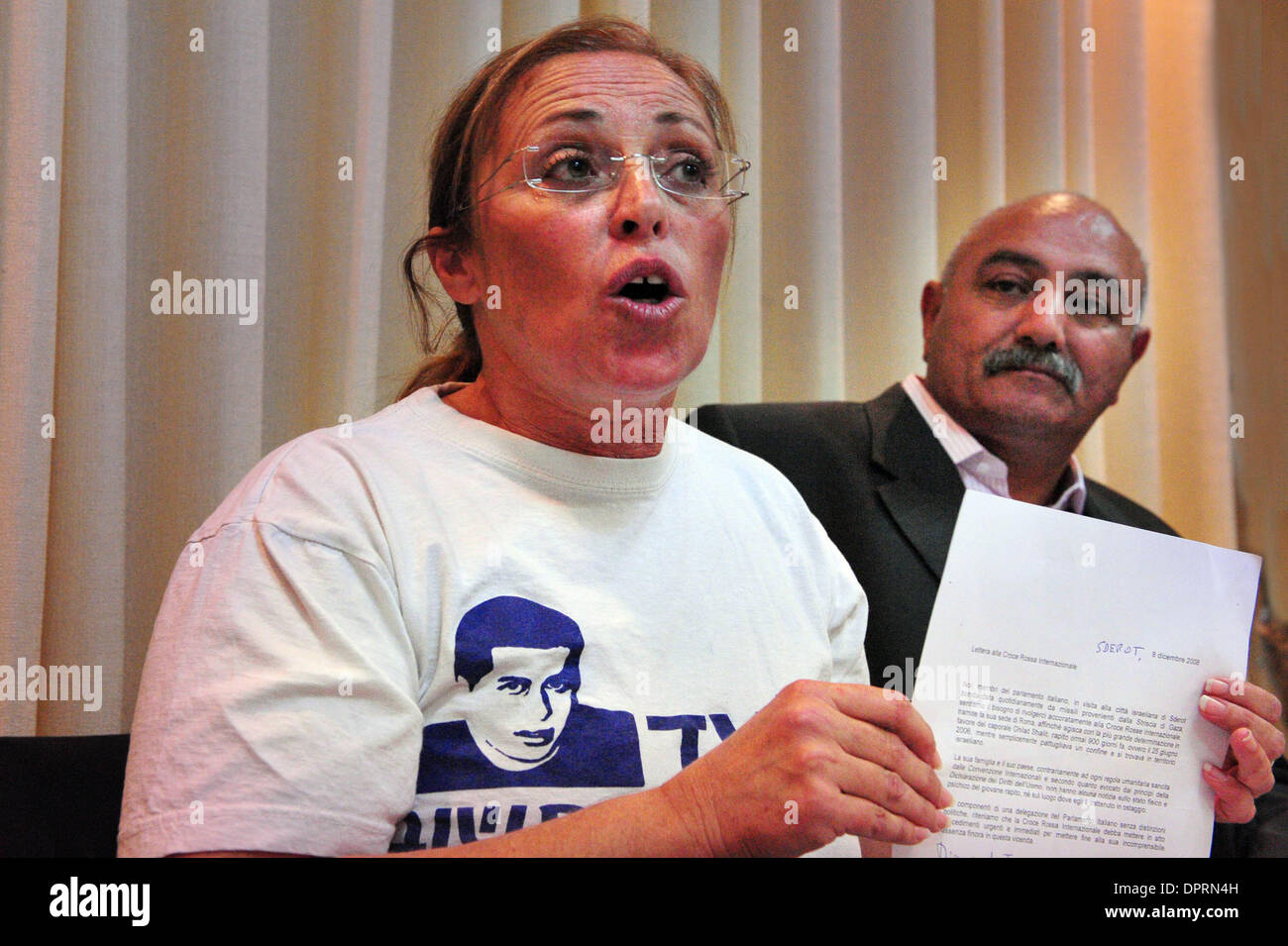 Dec 08, 2008 - Sderot, Israel - Italian Parliament member is handing a ...