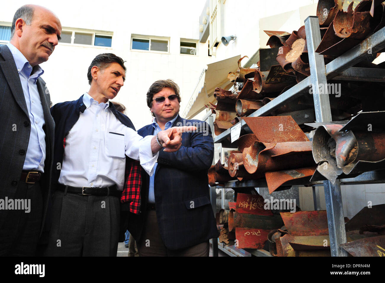 Dec 08, 2008 - Sderot, Israel - Italian Parliament member is handing a ...