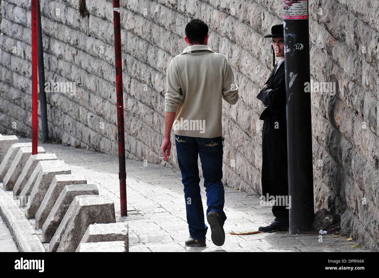 Dec 09, 2008 - Jerusalem, Israel - Jewish Orthodox Man and smoking arab ...