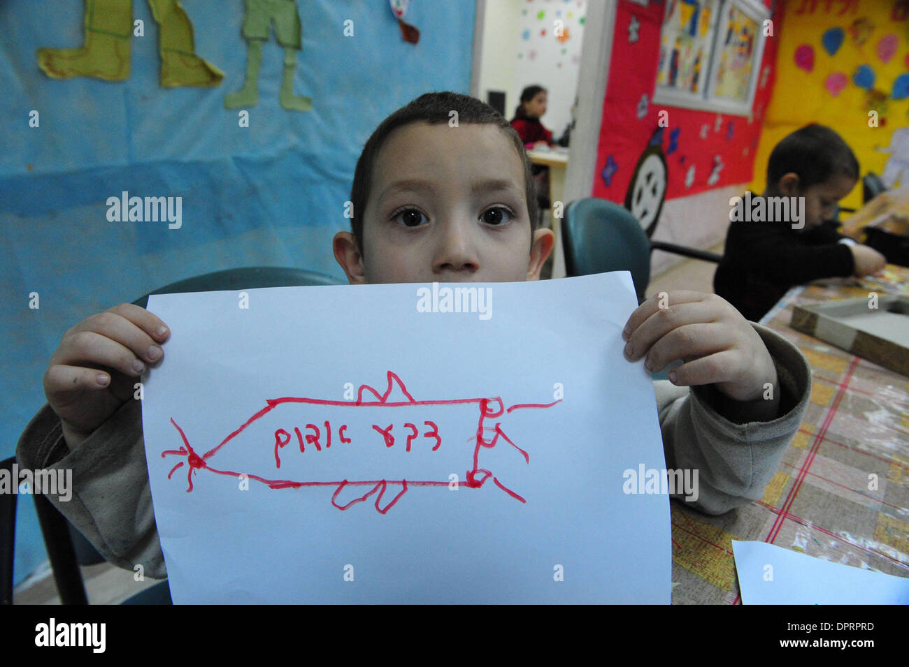 Jan 05, 2009 - Sderot, Israel - A child shows a drawing of a Kassam ...