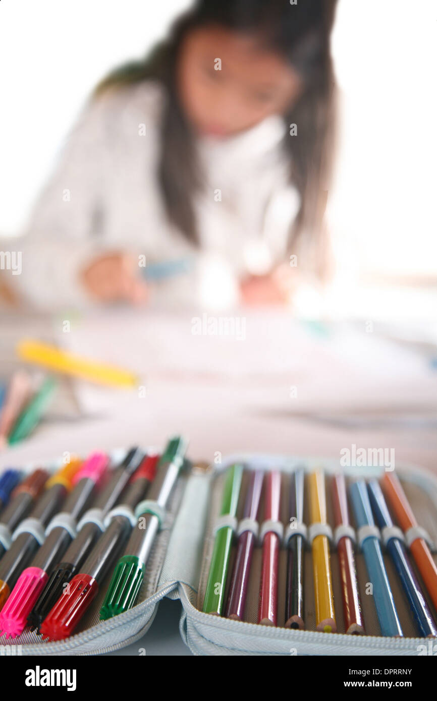 young child writing , painting and playing with colours (chinese child ...