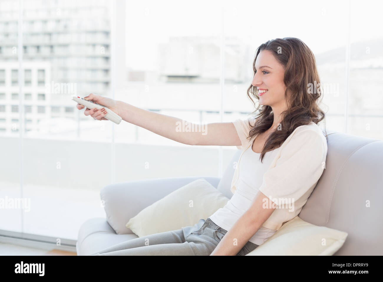 Woman remote control hi-res stock photography and images - Alamy