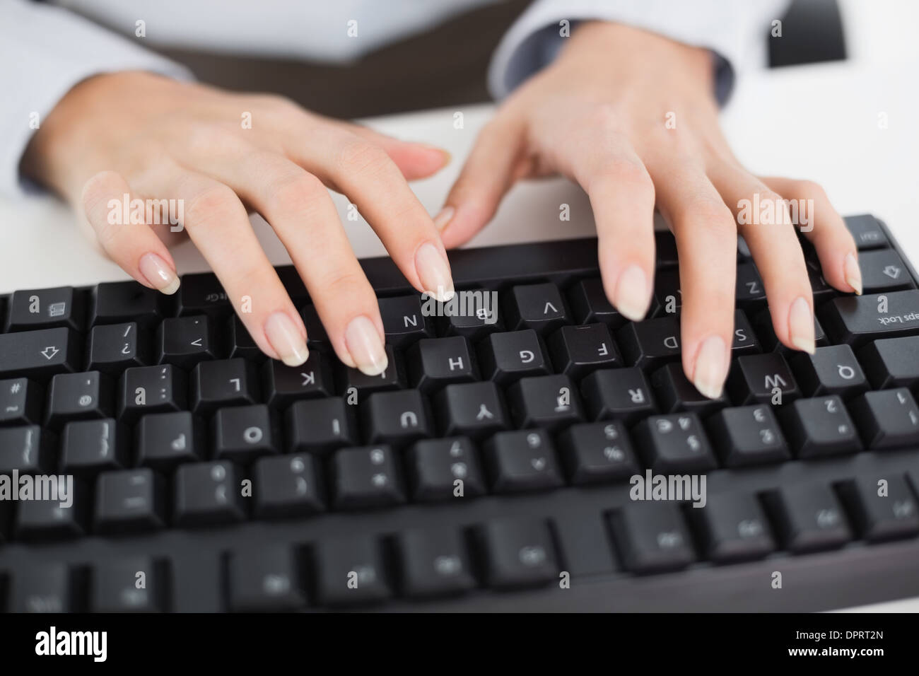 Close up of hands typing on a keyboard Stock Photo - Alamy