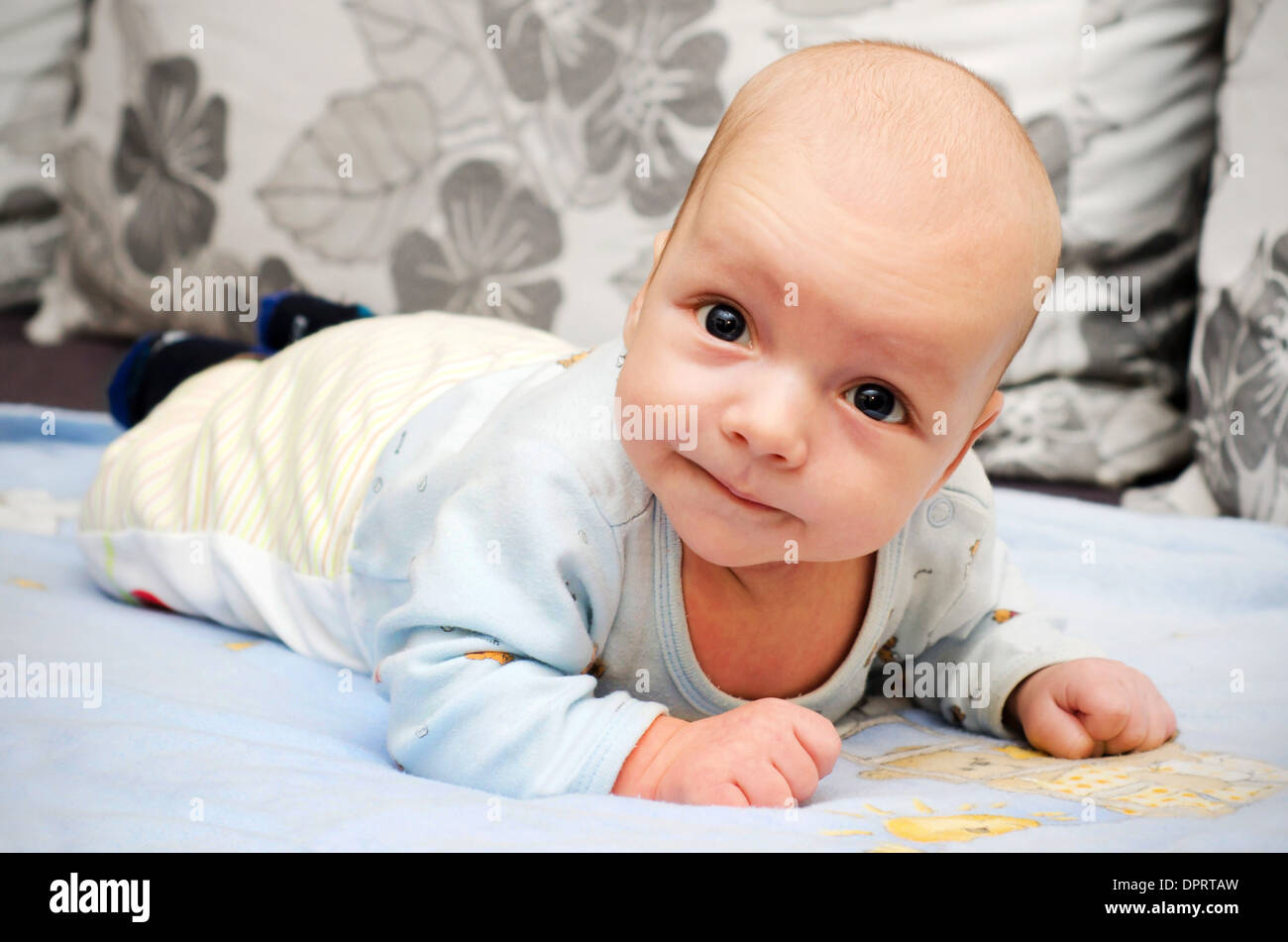 Little newborn baby boy lifting head Stock Photo - Alamy