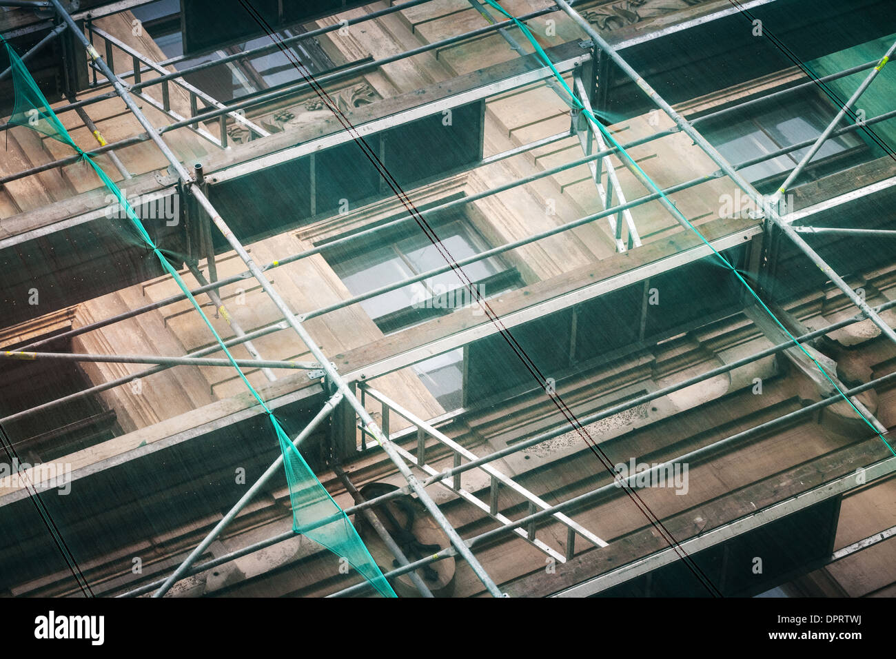 Old building facade under construction with green protective mesh Stock ...