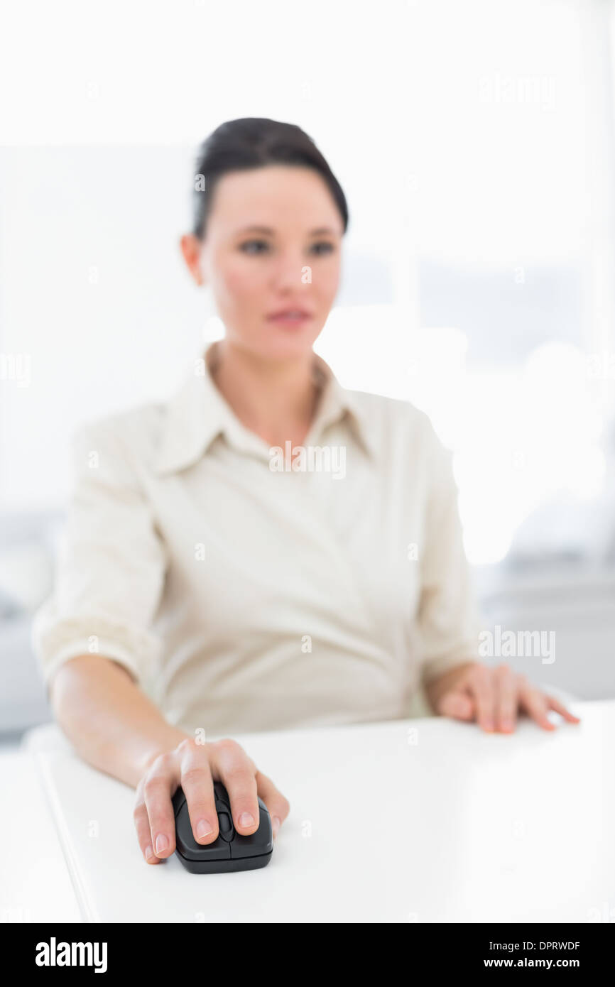 Portrait of a young businesswoman using computer mouse Stock Photo - Alamy