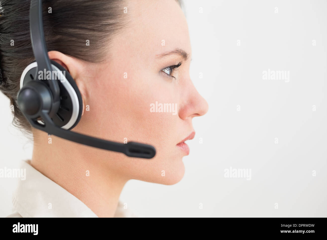 Close up side view of a beautiful businesswoman using headset Stock ...