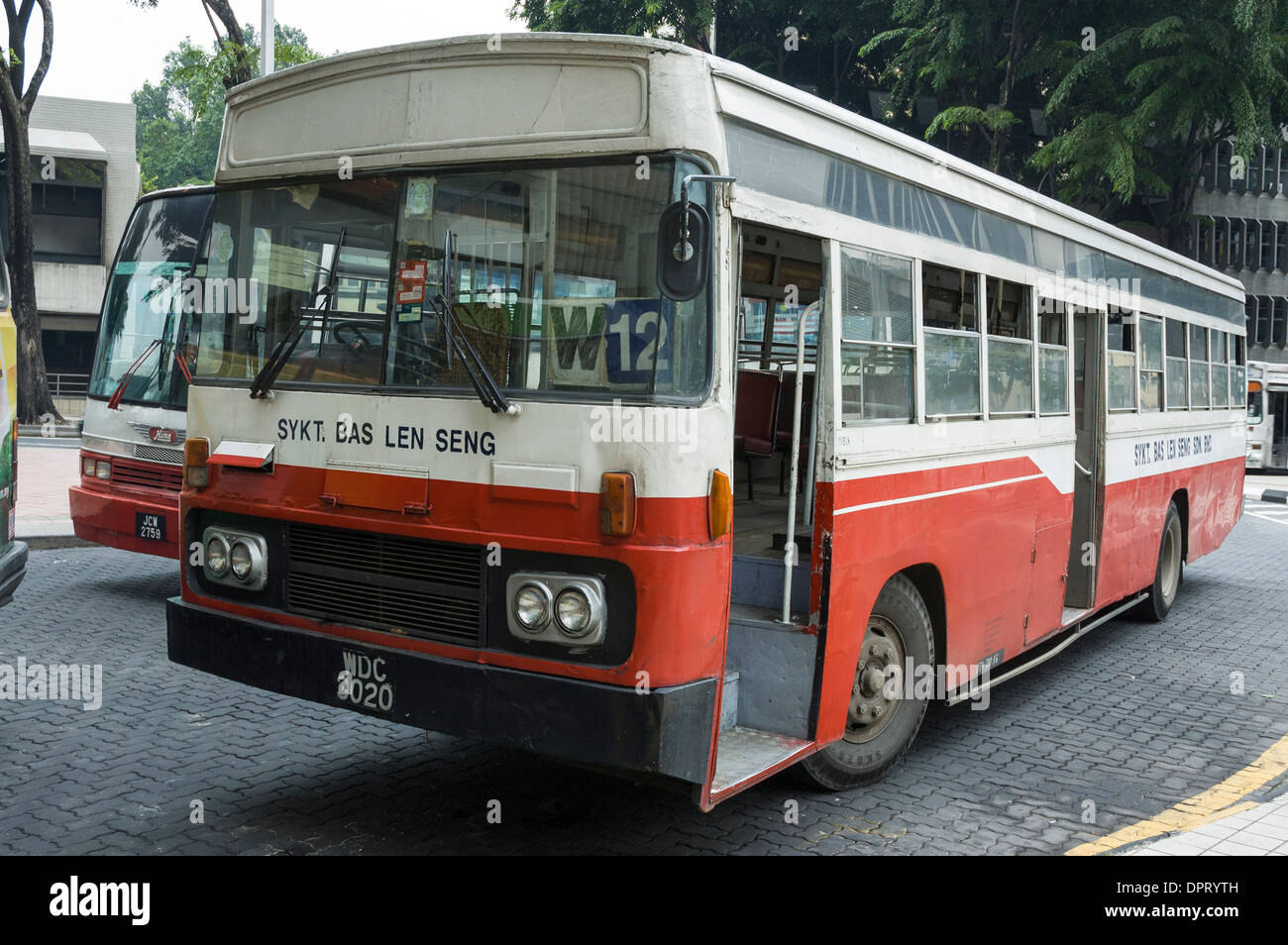 Very old red and while bus Stock Photo - Alamy
