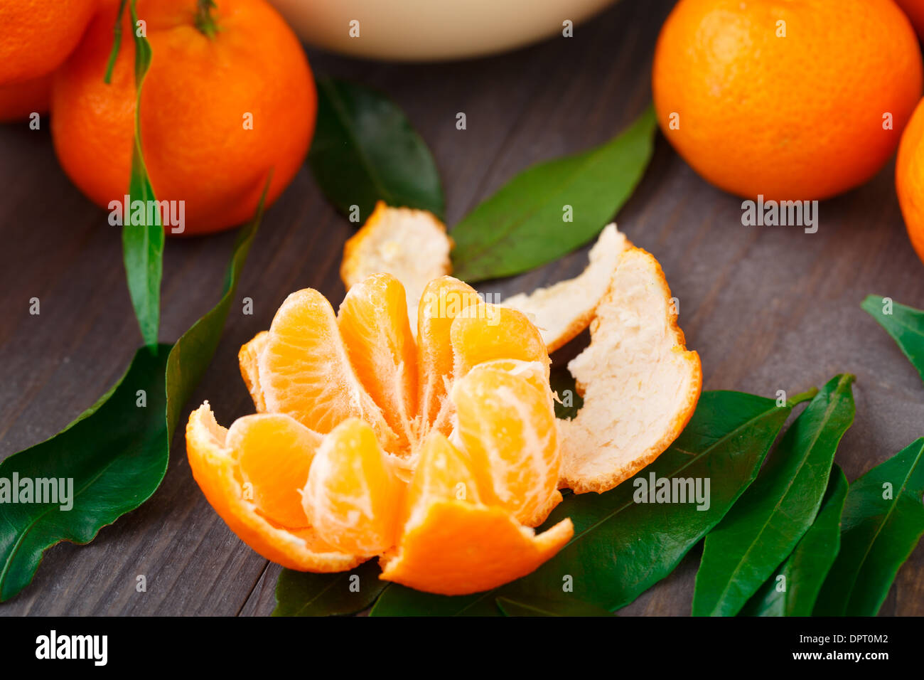 Tangerines on wooden background Stock Photo - Alamy