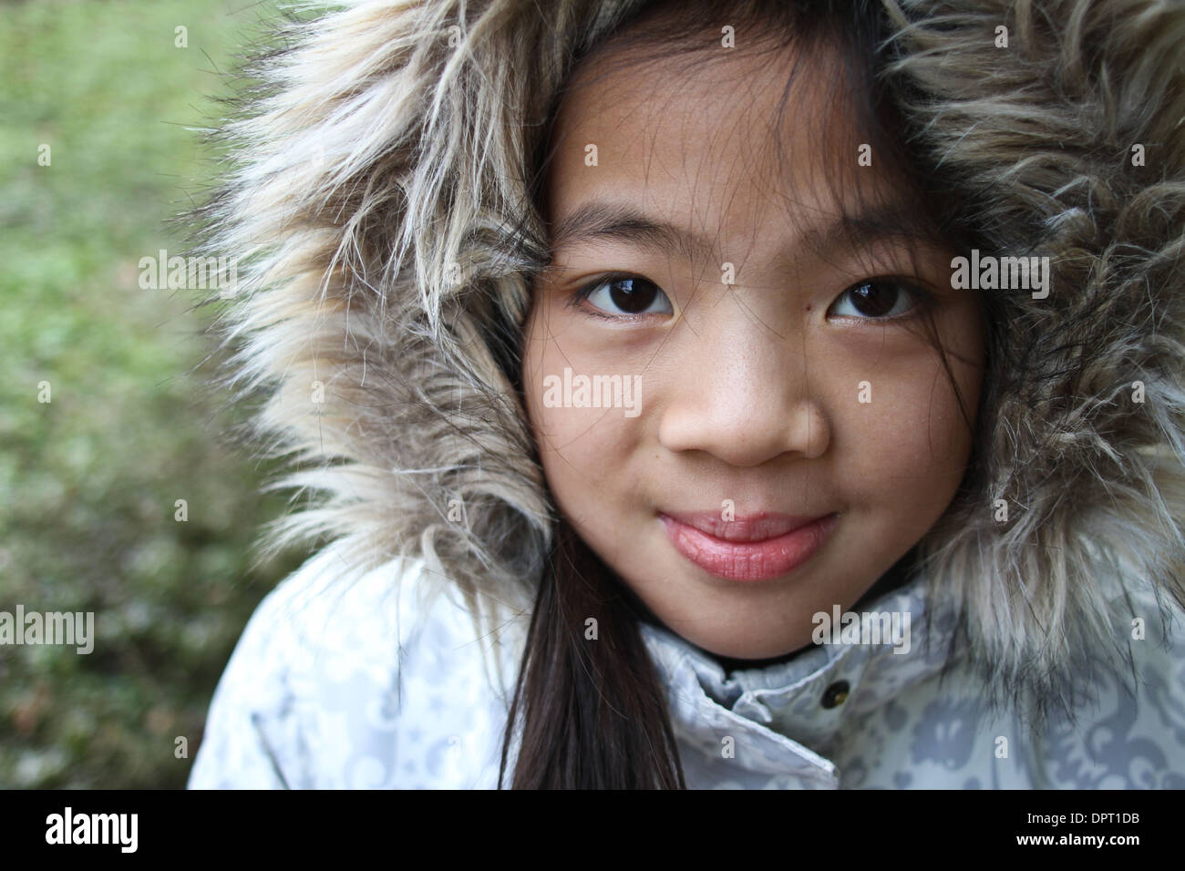 cute chinese girl with hat in winter portrait Stock Photo - Alamy