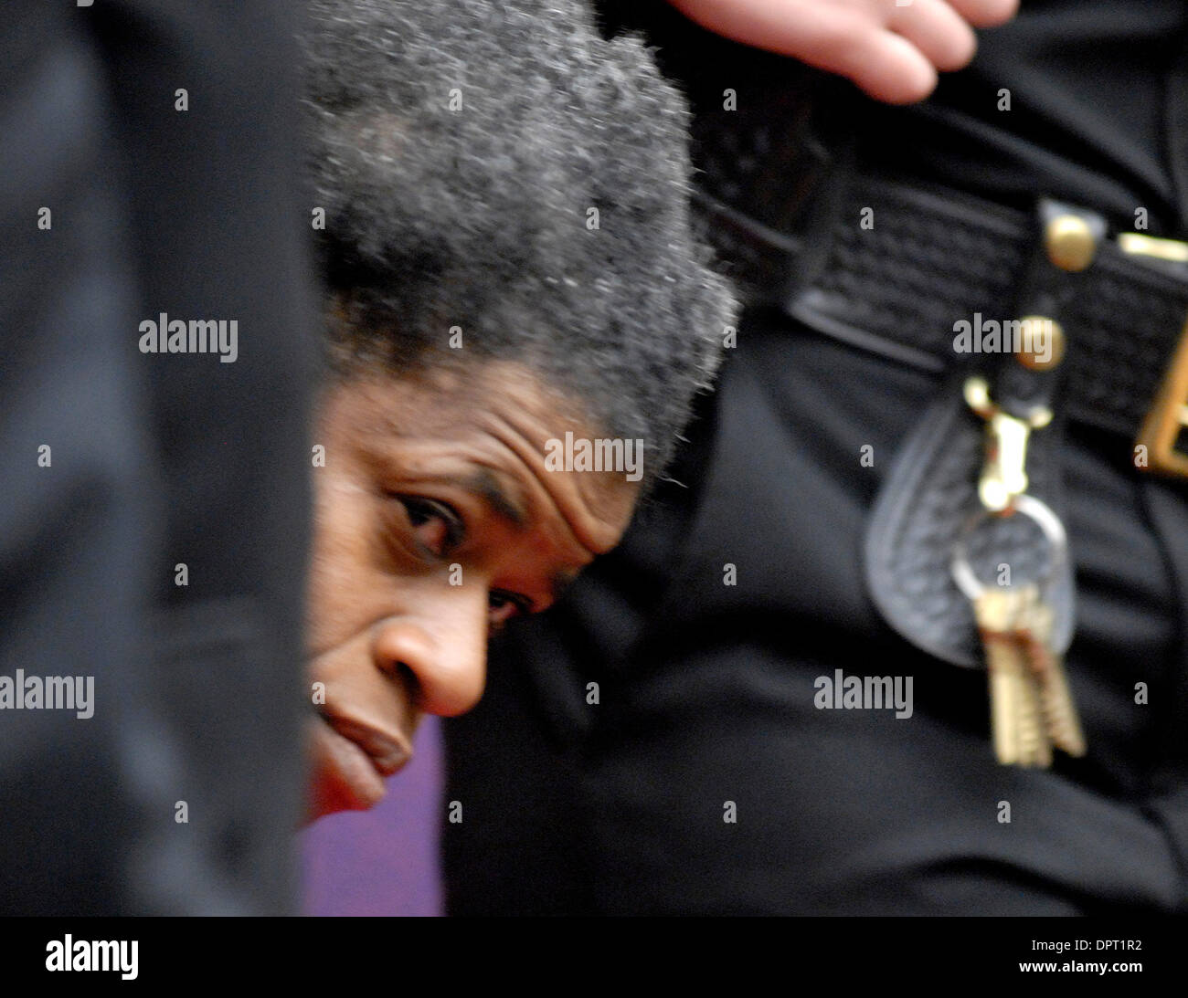 Caren Ramirez peeks out past her appointed attorney, Douglas Jacobsen ...