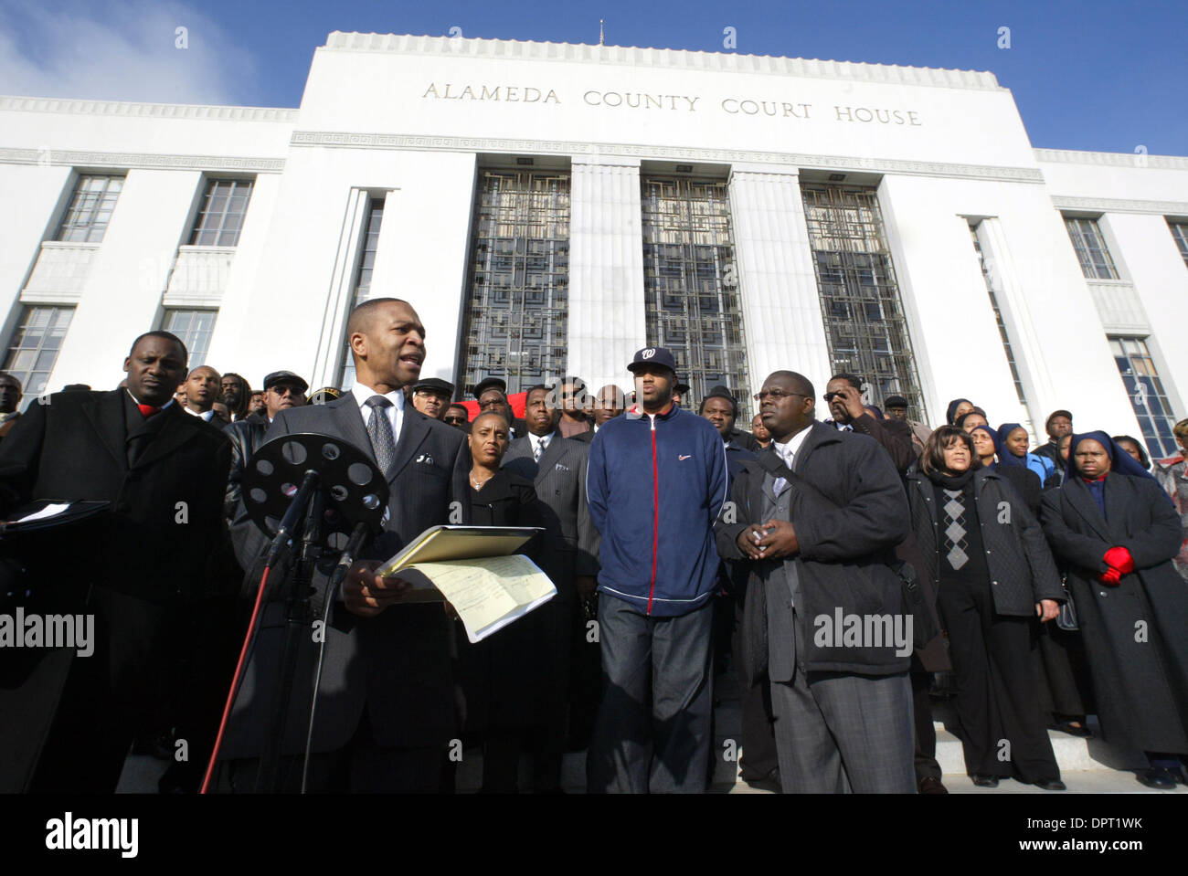 African American leaders and community members gather on the steps of ...