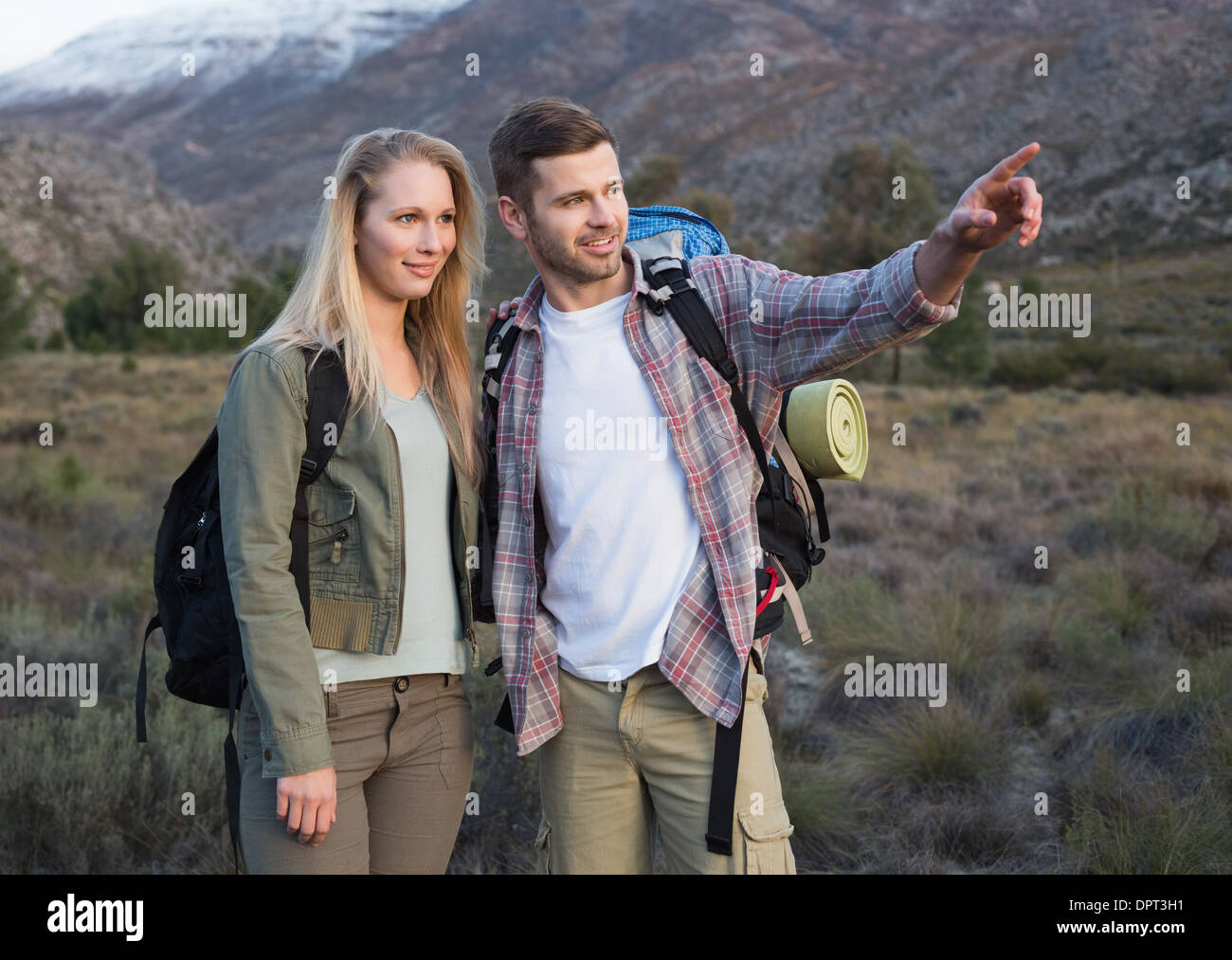 Young couple standing backpacks hi-res stock photography and images - Alamy