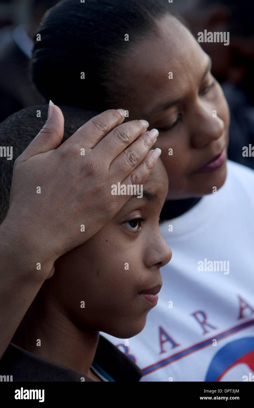 Betty Chatman holds onto her son, Isaiah, 11, during a vigil to honor ...