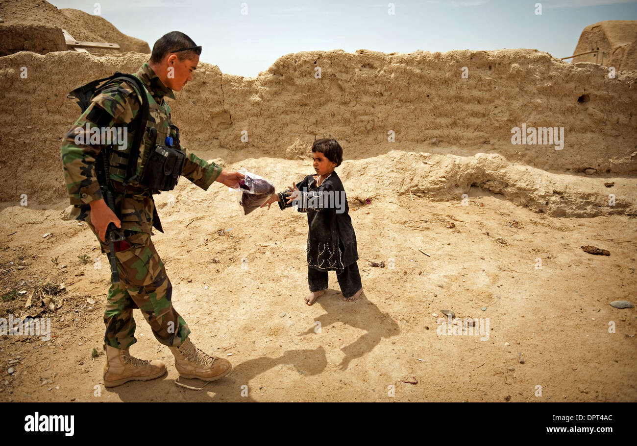 Apr 16, 2009 - Ghows Kalay, Afghanistan - An Afghan Commando hands some ...