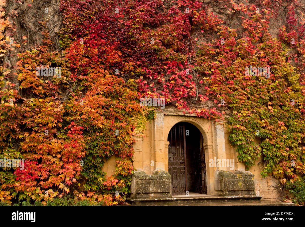Virginia Creeper-covered gateway at Biron Castle / Chateau de Biron ...