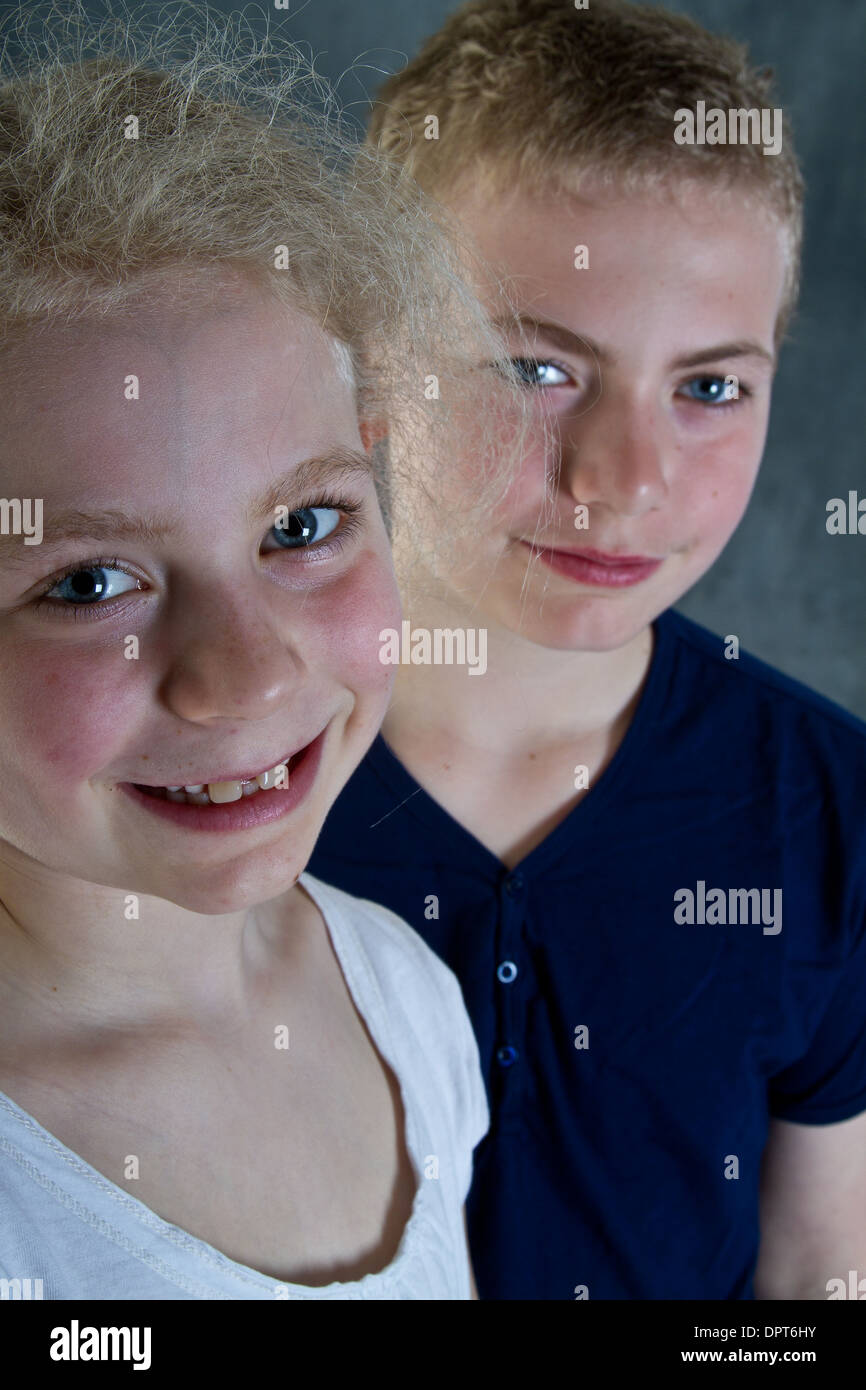 Brother and sister children; shot in studio Stock Photo - Alamy