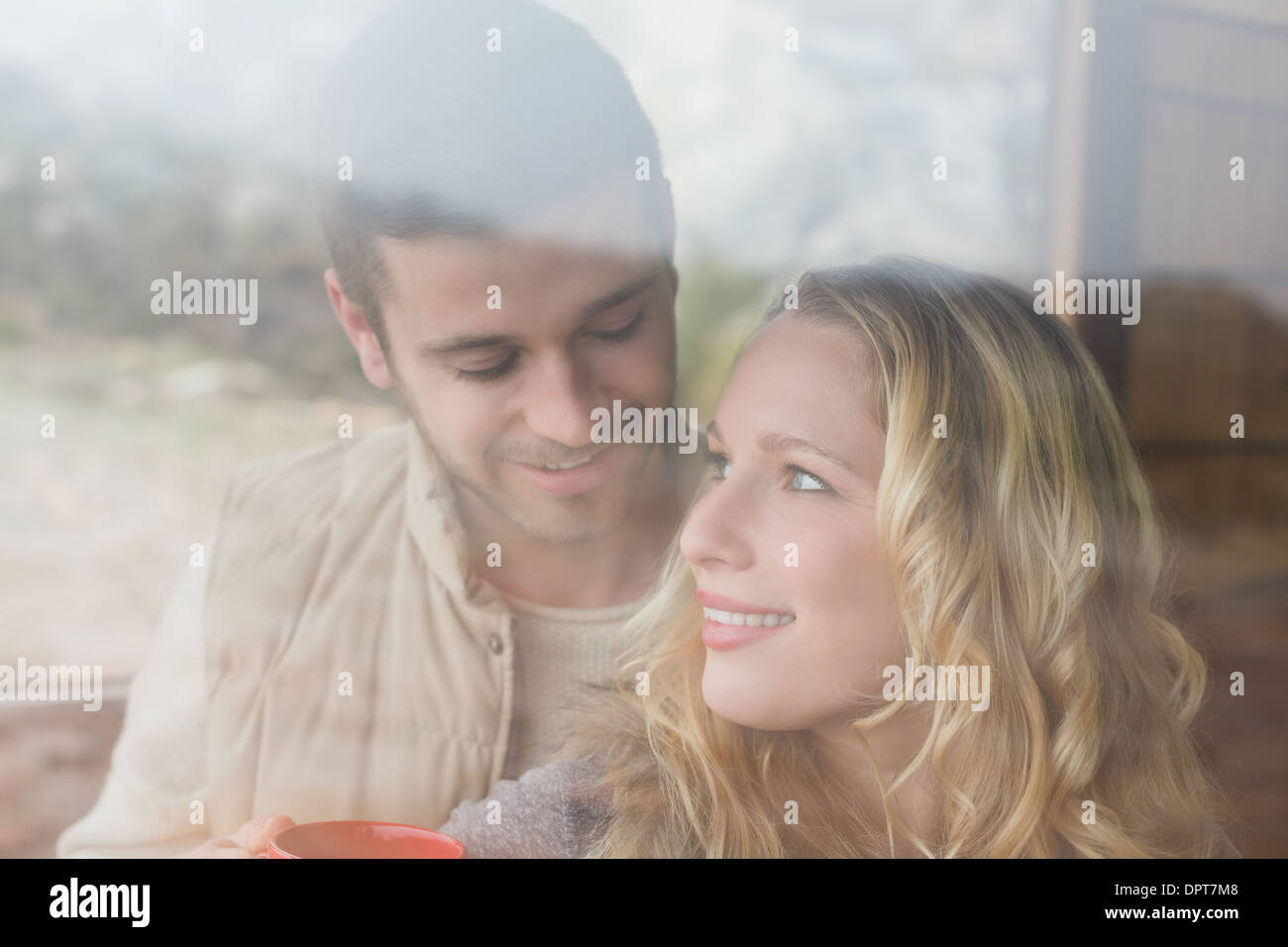 Loving couple seen through cabin window Stock Photo - Alamy