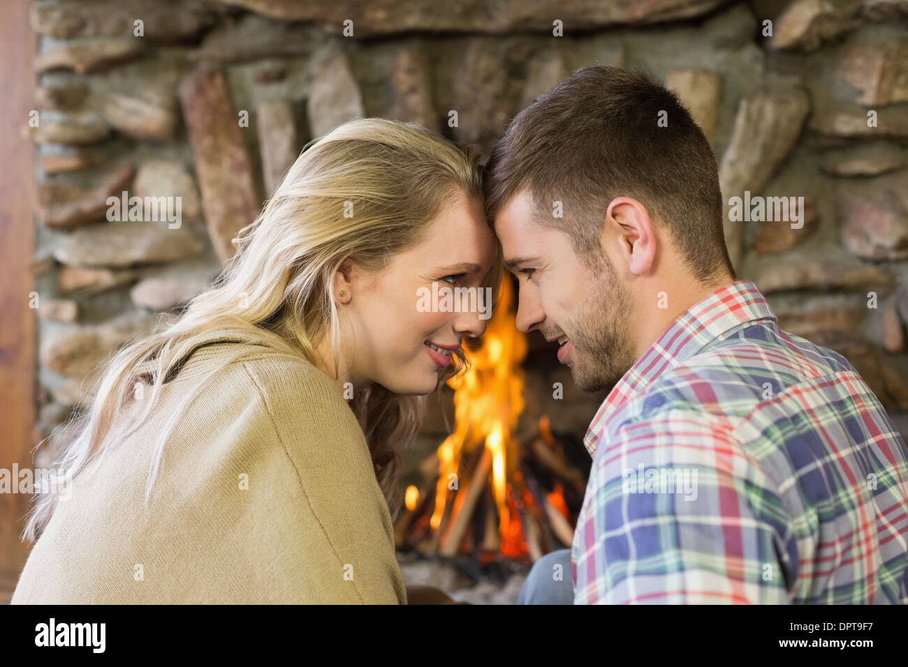 Couple fireplace romantic hi-res stock photography and images - Alamy