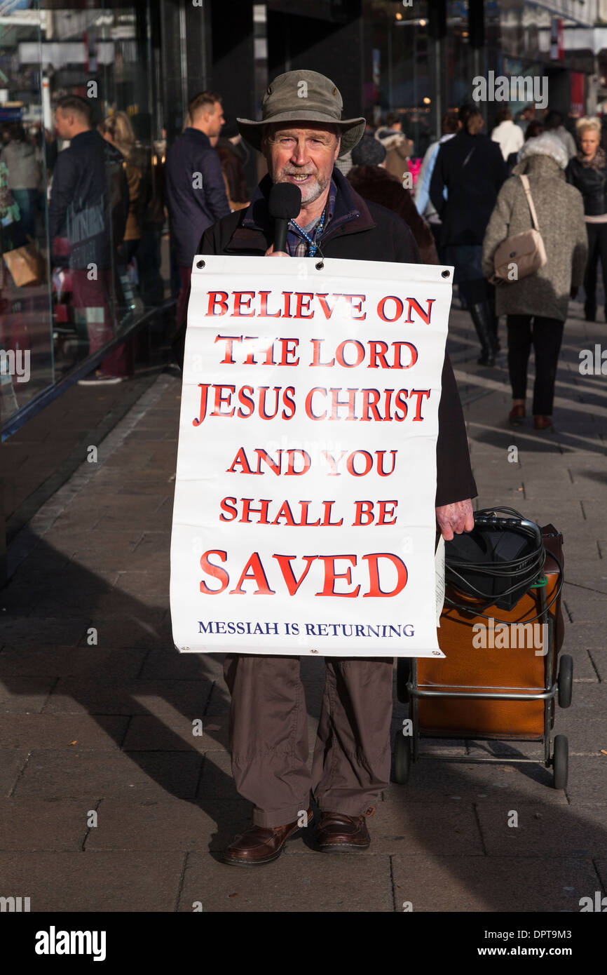 Town centre high street religious preacher with poster Stock Photo - Alamy