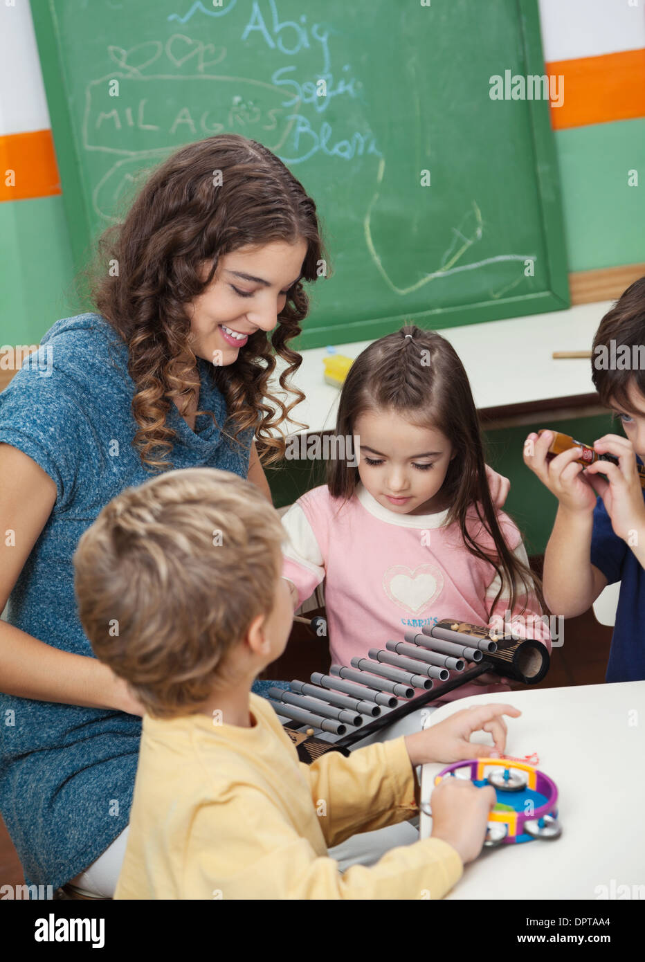Teacher And Children Playing With Xylophone In Class Stock Photo - Alamy