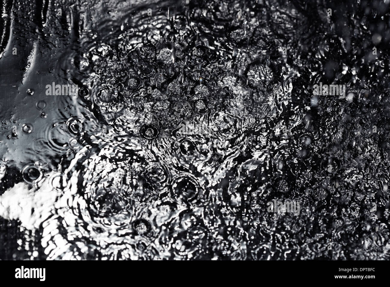 Top view on the ground with oil during rain Stock Photo - Alamy