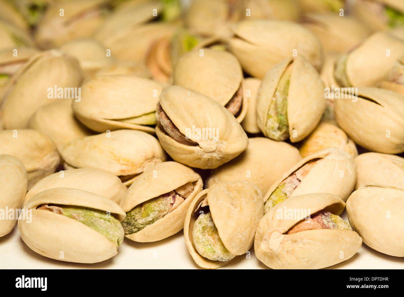 Dry Roasted and Salted Pistachio Nuts with shell on white background Stock Photo - Alamy