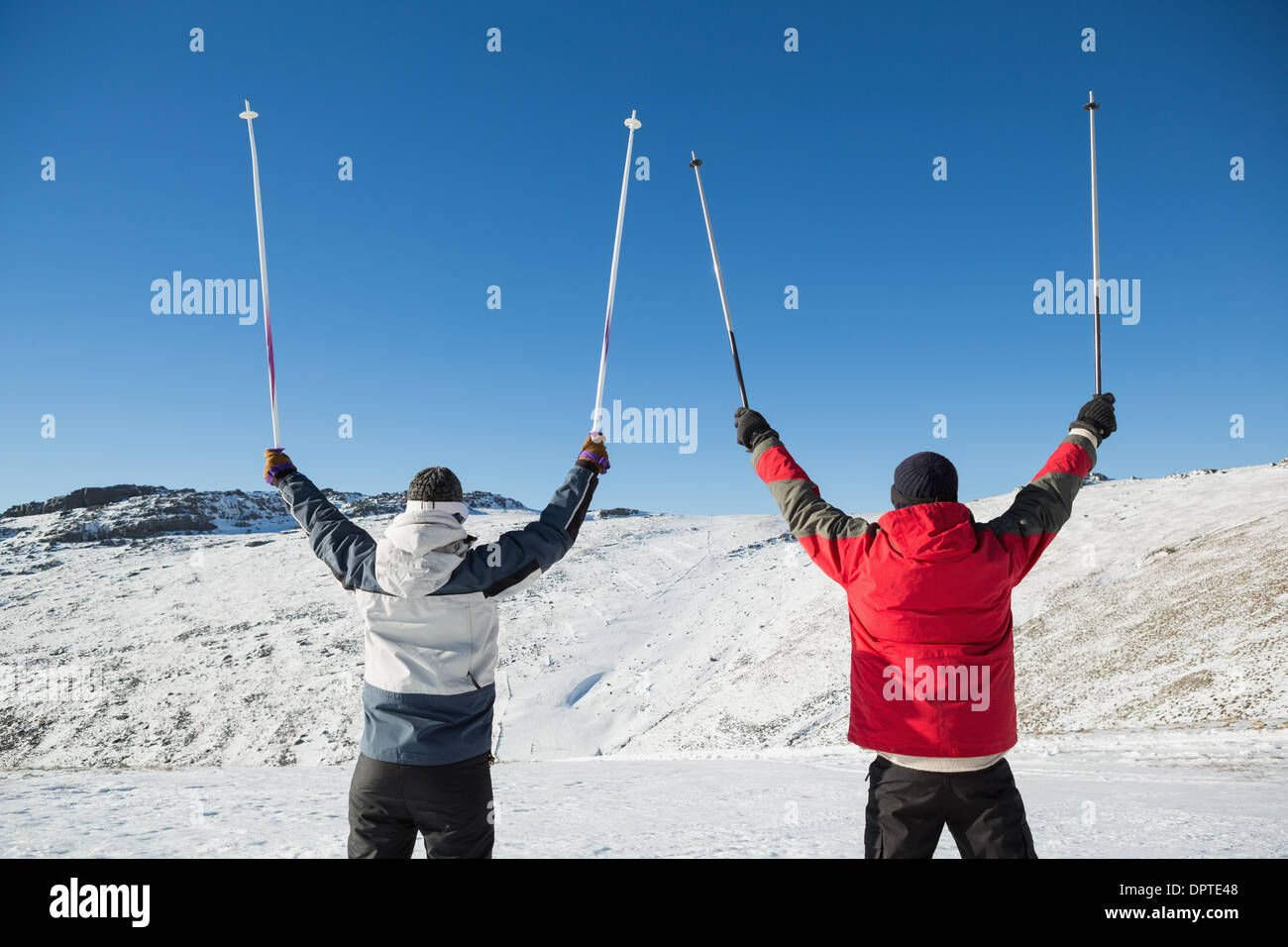 Successful woman raising hands outdoors hi-res stock photography and ...