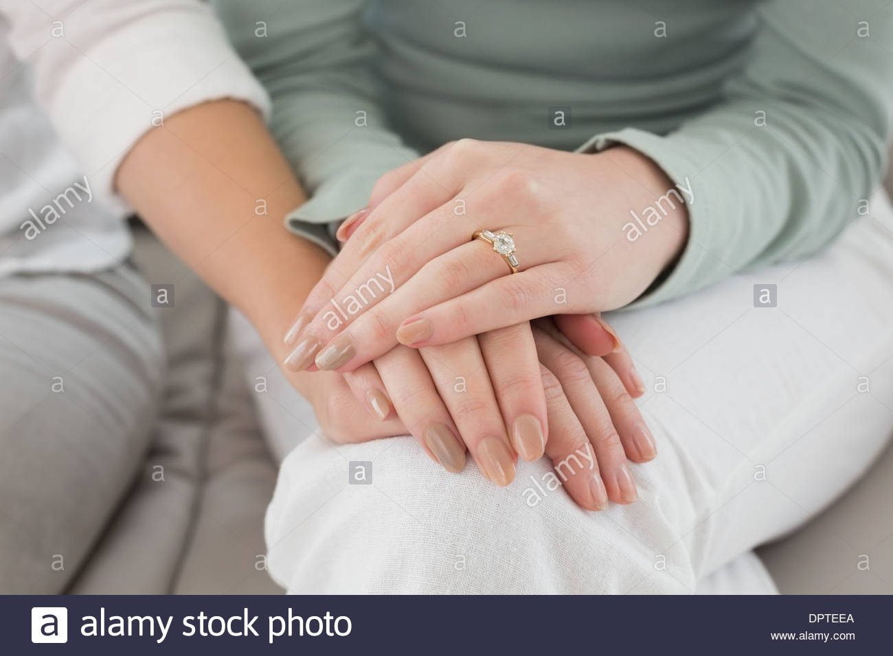 Close friends touching hands hi-res stock photography and images - Alamy
