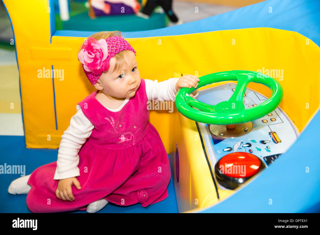 Happy baby girl keep on board ship on playground The concept of ...
