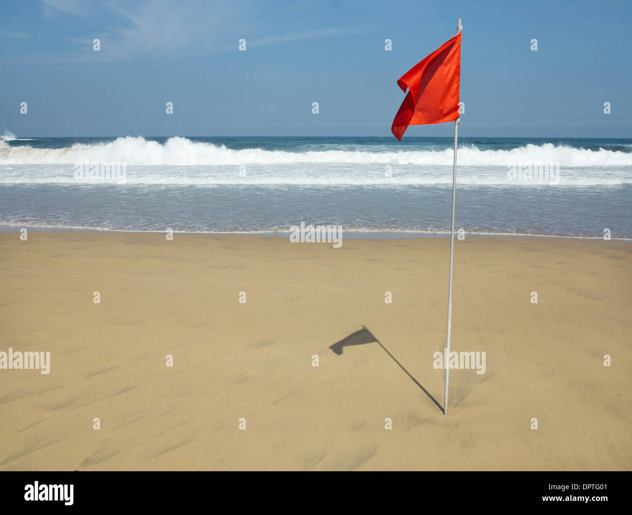 red "no bathing" flag planted in the sand on Zurriola beach, San ...