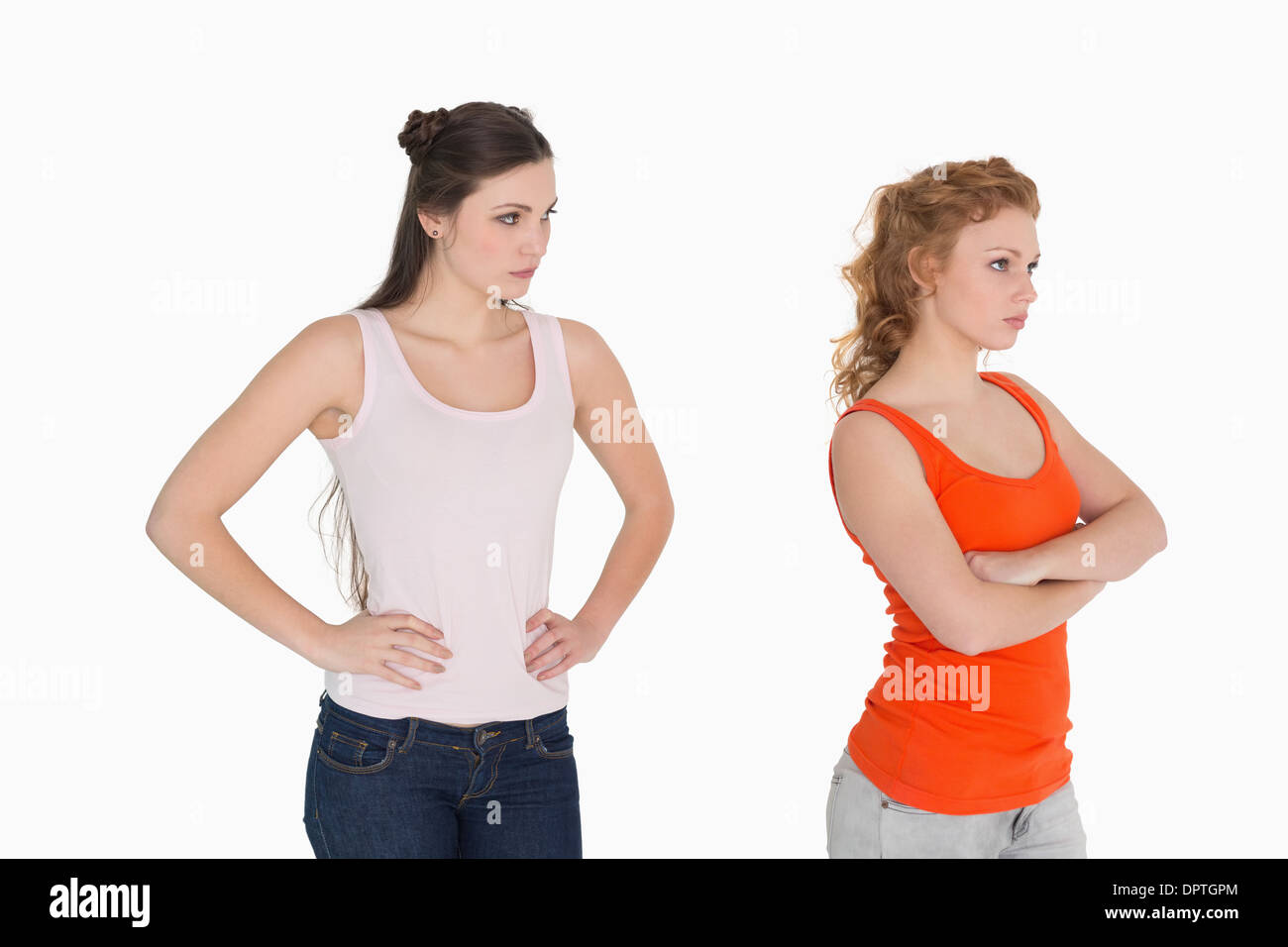 Unhappy young female friends not talking after argument Stock Photo - Alamy