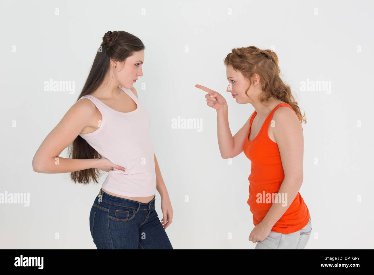Angry young female friends having an argument Stock Photo - Alamy