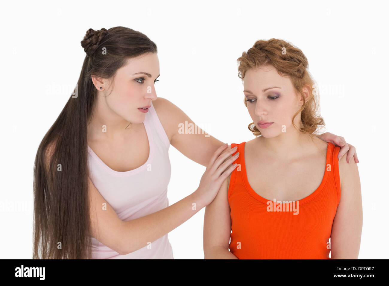 Young woman consoling female friend Stock Photo - Alamy