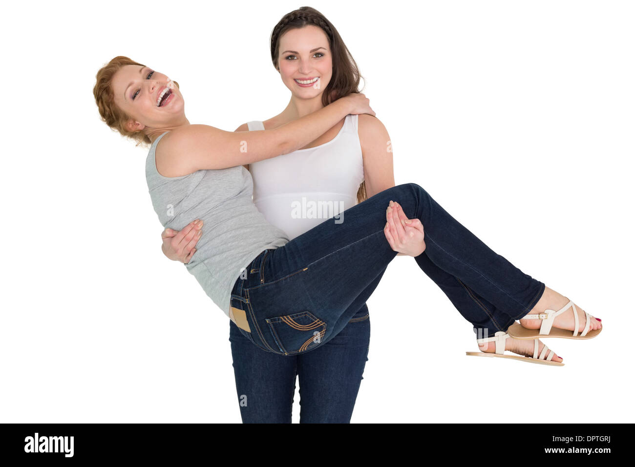 Portrait of a young female carrying her cheerful friend Stock Photo - Alamy